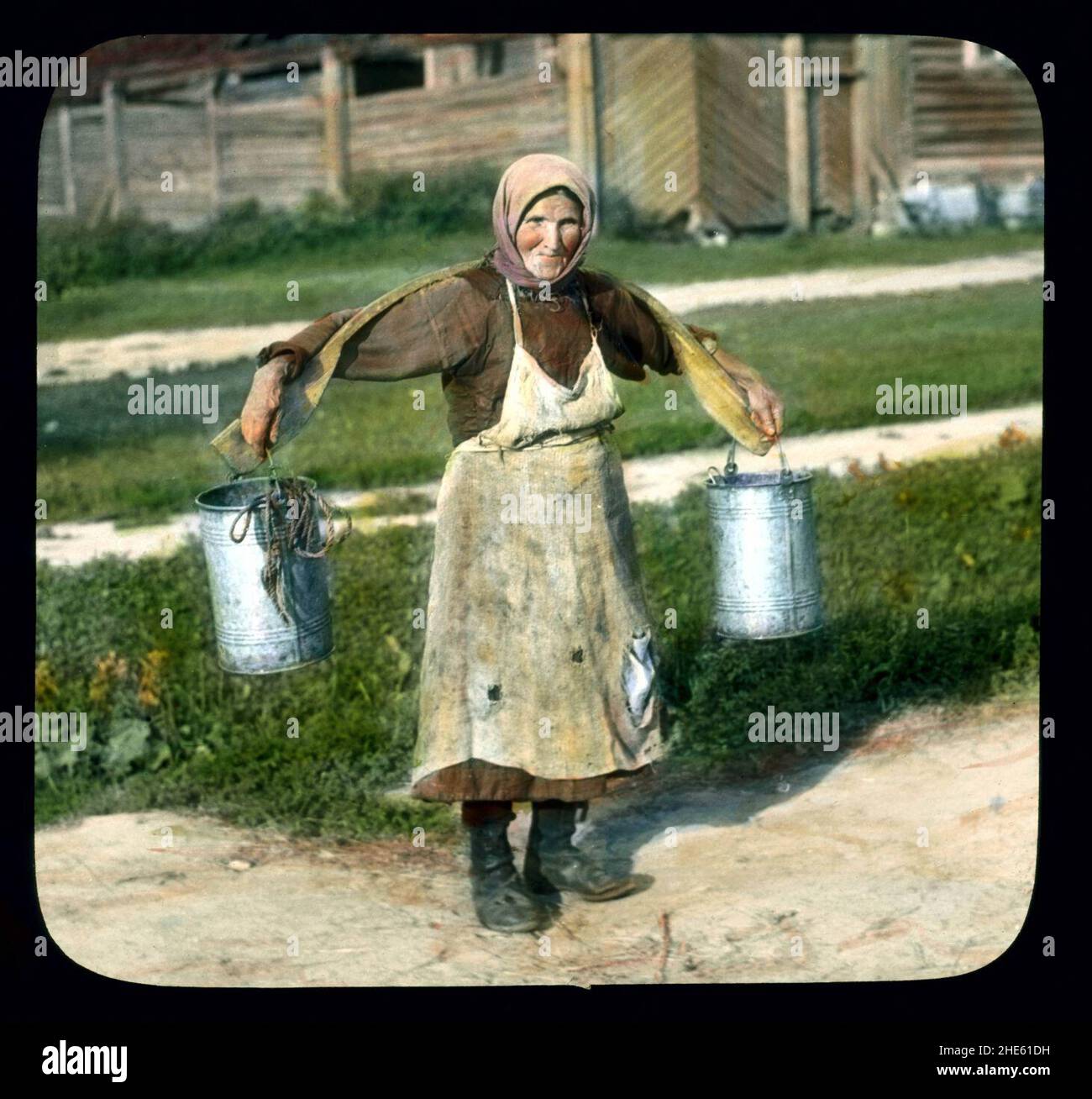 Saint Petersburg woman carrying buckets of water, near Leningrad Stock ...