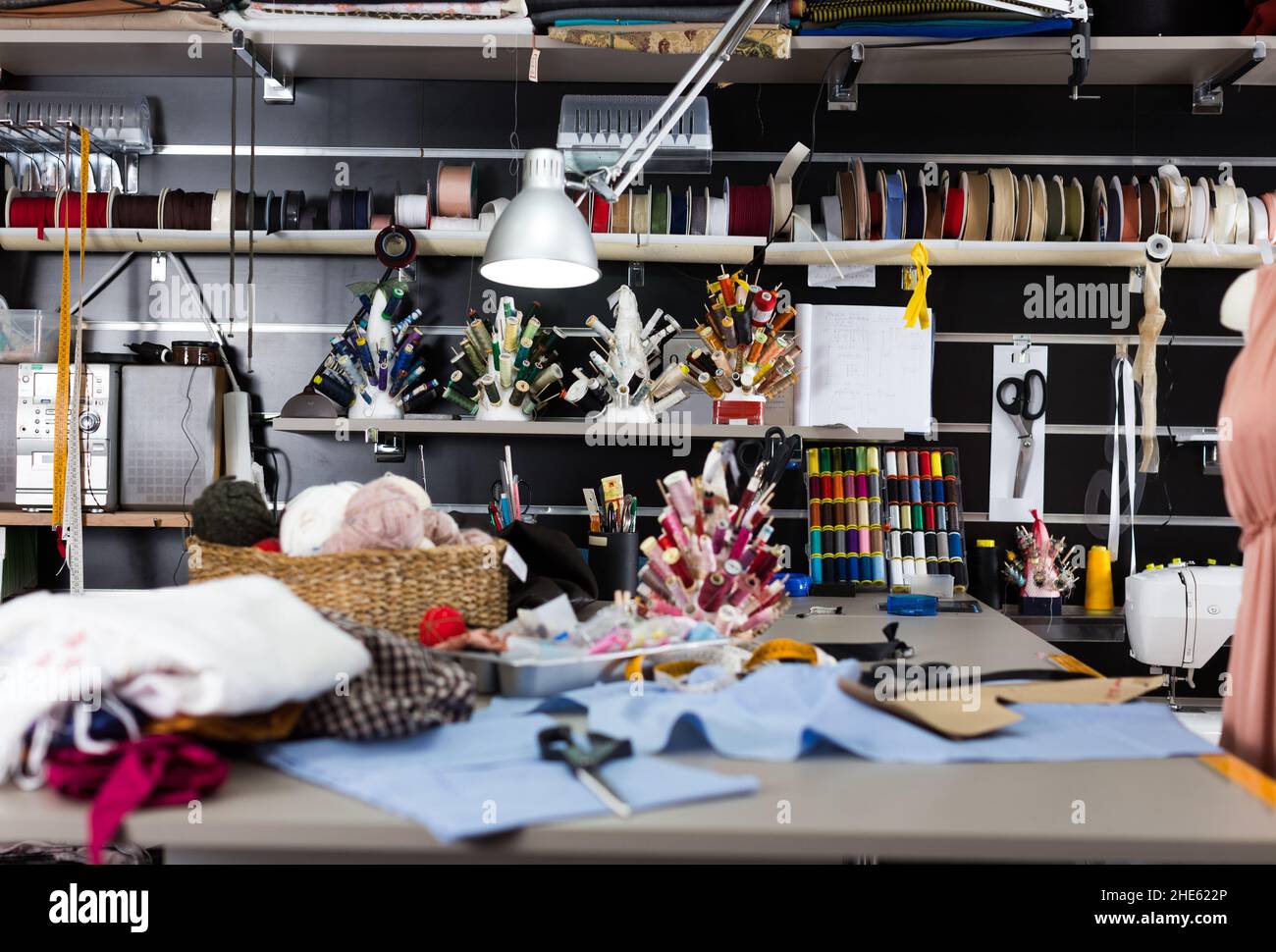 Image of workplace in sewing shop of variety clothes factory Stock ...