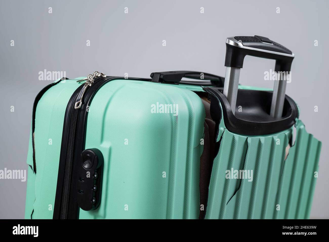Close-up of a broken plastic suitcase on a white background Stock Photo ...