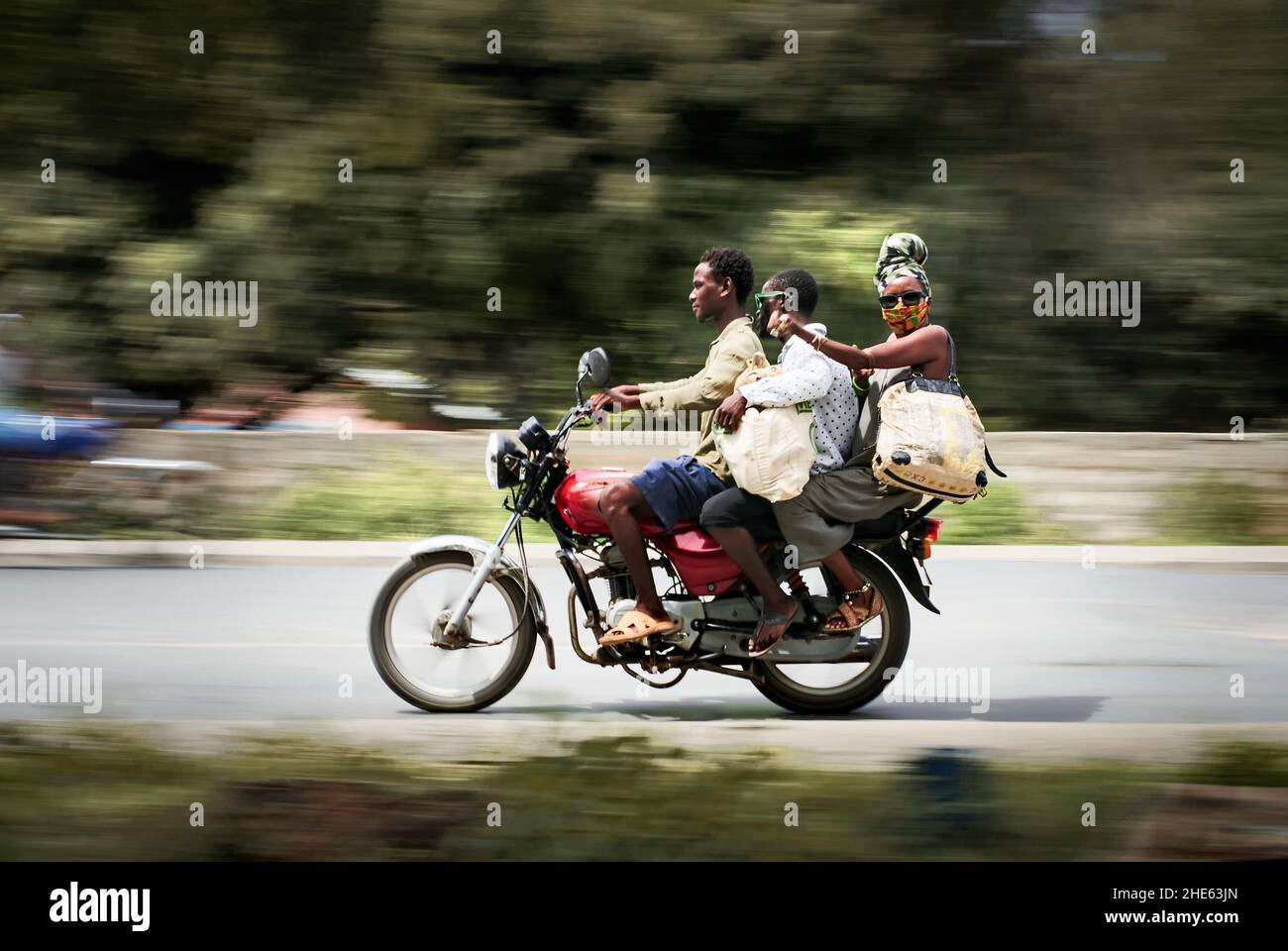 Three people riding a motorcycle hi-res stock photography and images ...