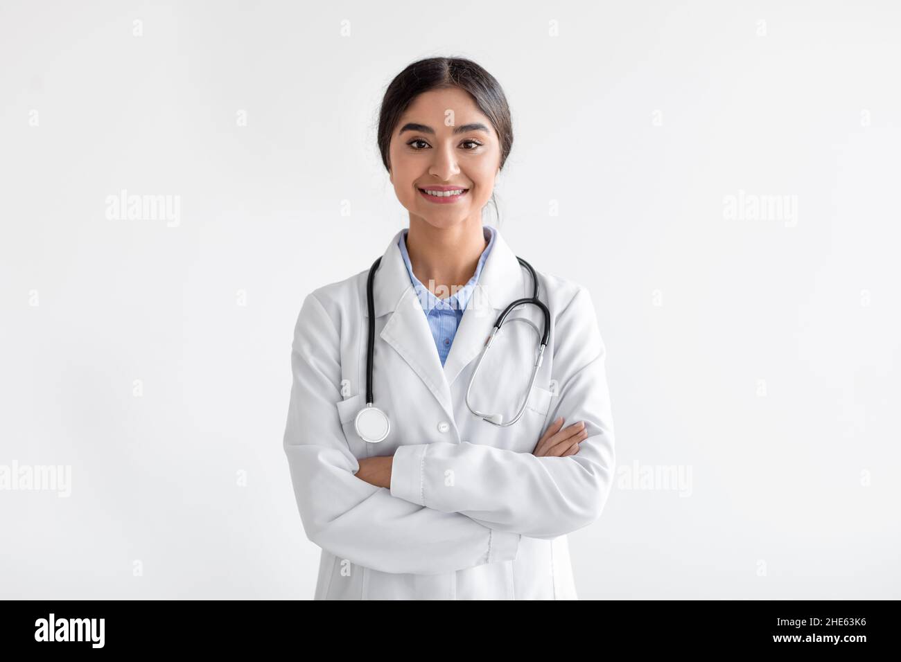 Confident cheerful millennial cute indian woman nurse in uniform with ...