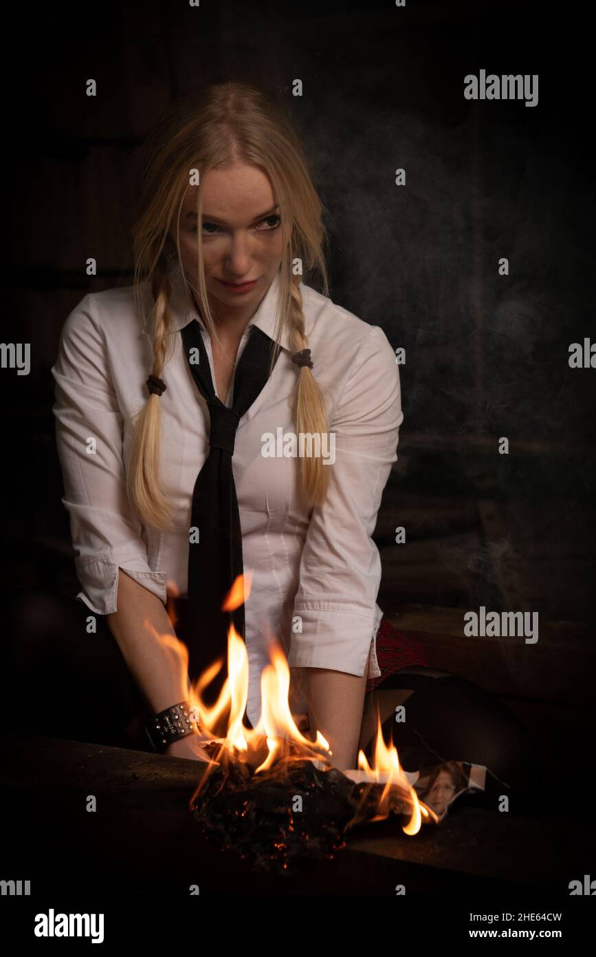 Woman burn paper flame hi-res stock photography and images - Alamy