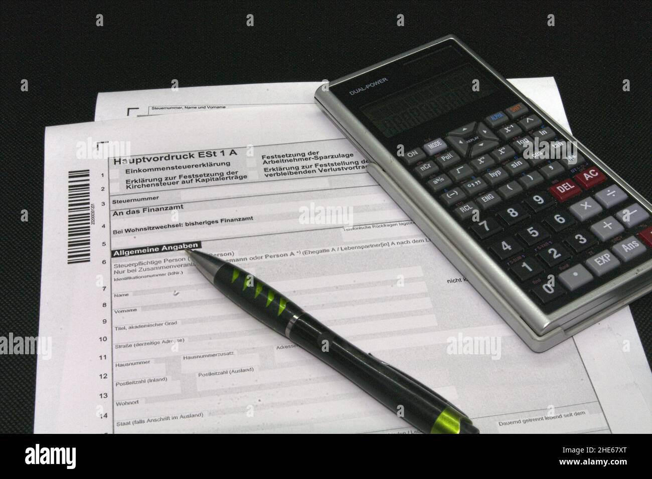 Germany, symbol photo, tax return form with pen and calculator Stock ...