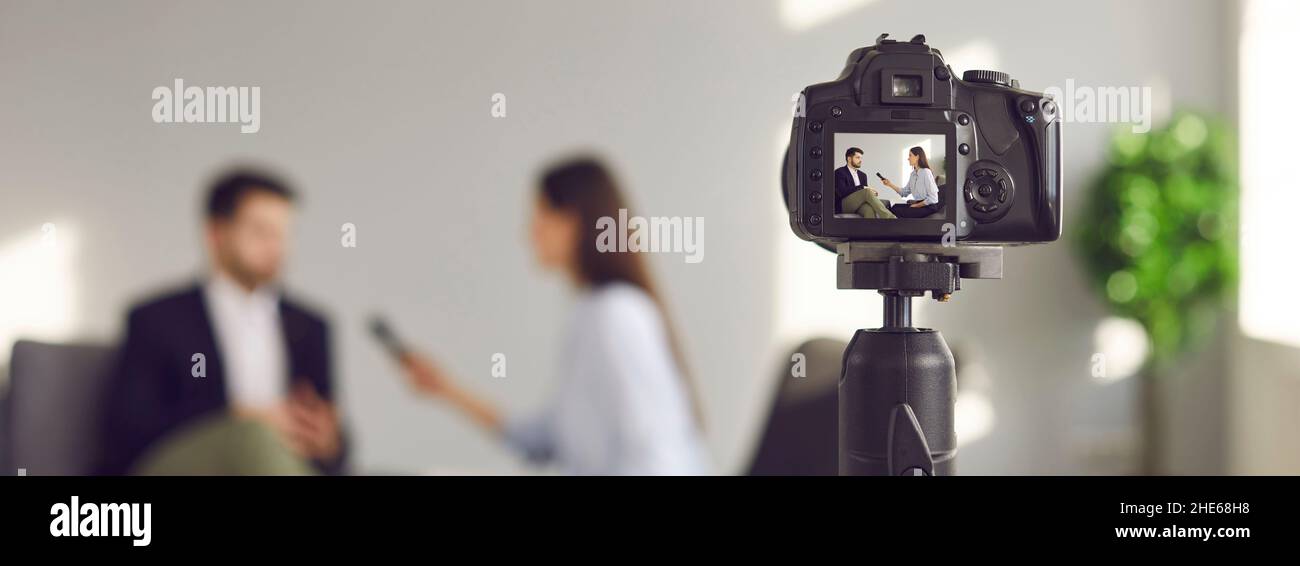 Banner background with a close up shot of a video camera recording an ...