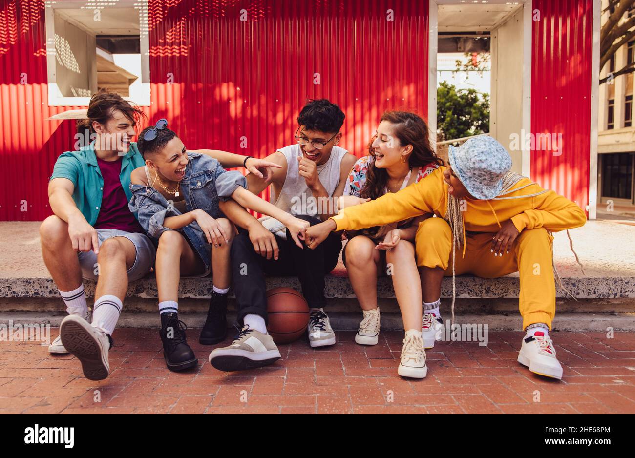 Enjoying a good time with friends in the city. Group of multiethnic ...