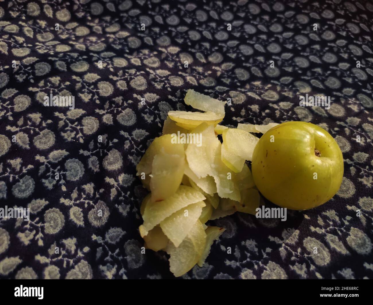 indian gooseberry or amla kept in sunlight for drying. chopped fresh ...
