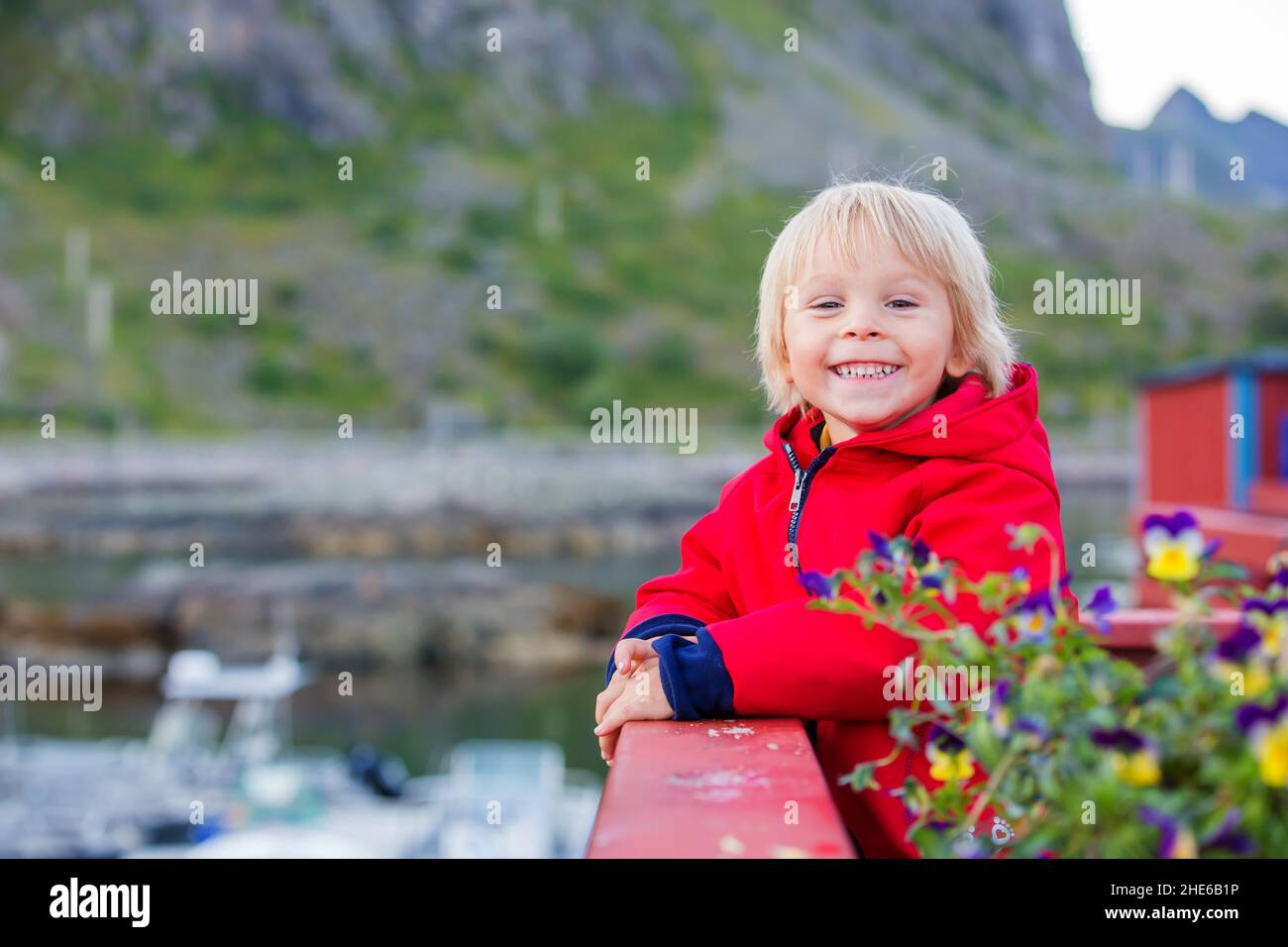 Cute little child, enjoying the view in small A village on the end of ...