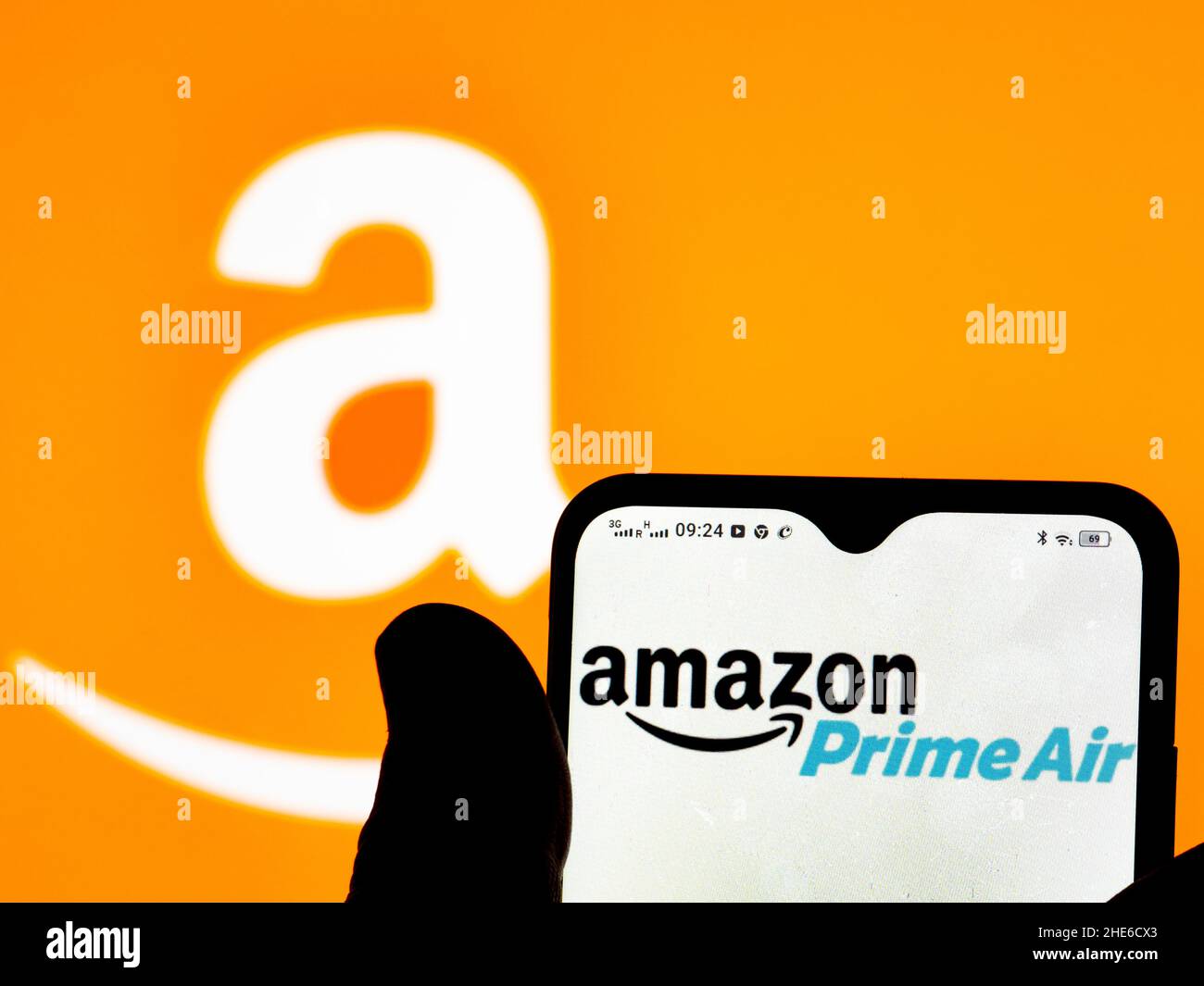 In this photo illustration an Amazon Prime Air logo seen displayed on a ...