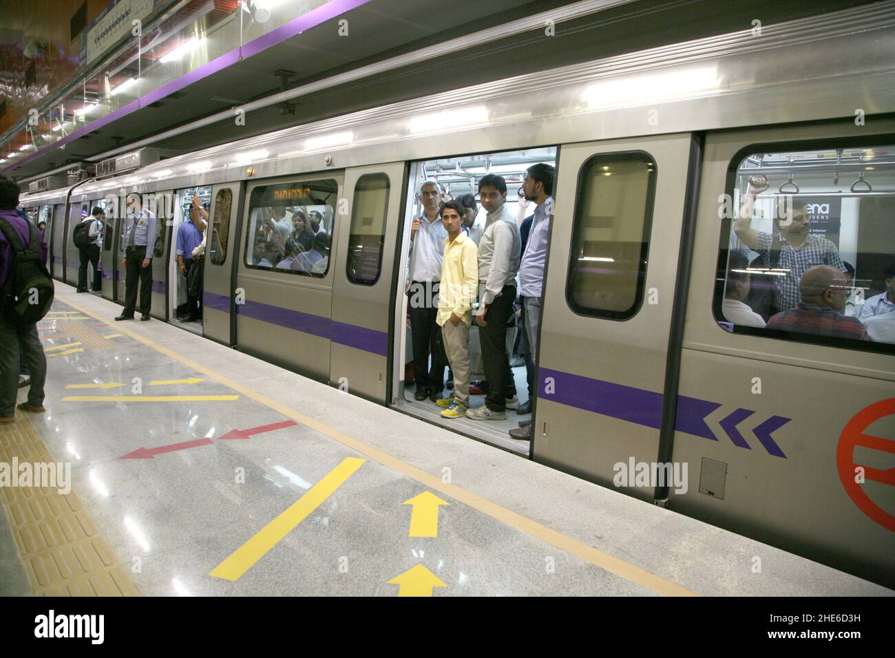 Passengers wait for their turn to board in a metro train at metro ...