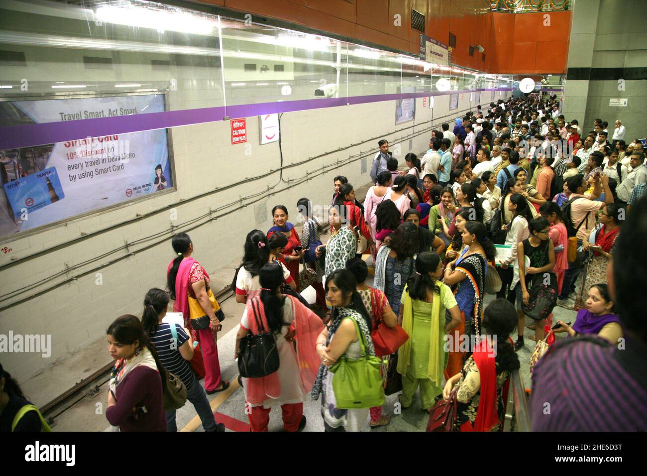 Passengers wait for their turn to board in a metro train at metro ...