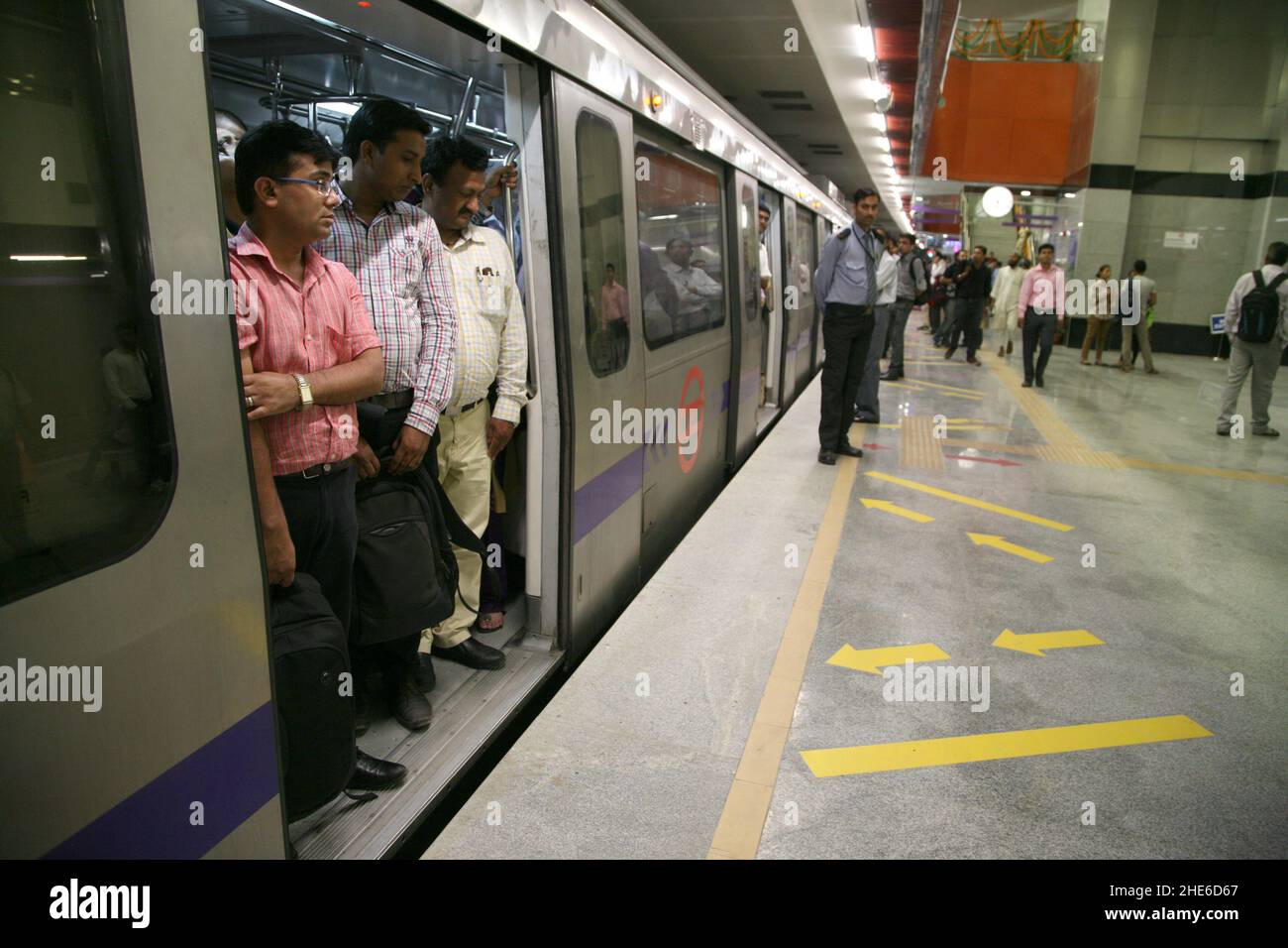 Passengers wait for their turn to board in a metro train at metro ...