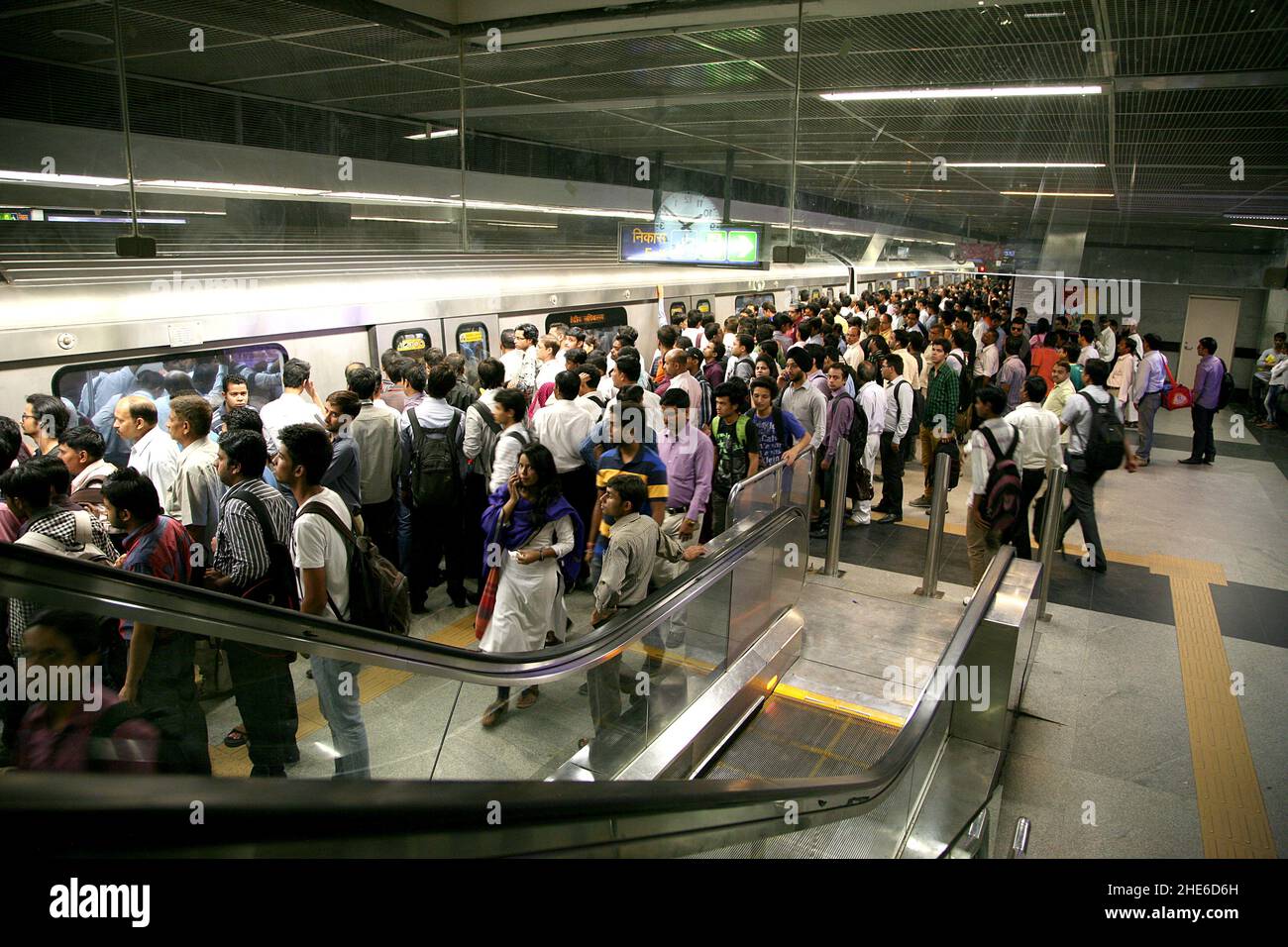Passengers wait for their turn to board in a metro train at metro ...