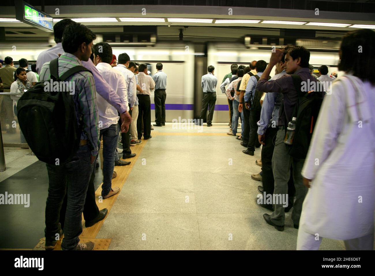 Passengers wait for their turn to board in a metro train at metro ...
