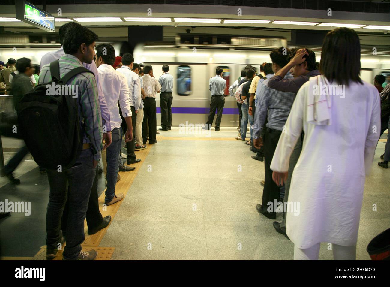 Passengers wait for their turn to board in a metro train at metro ...