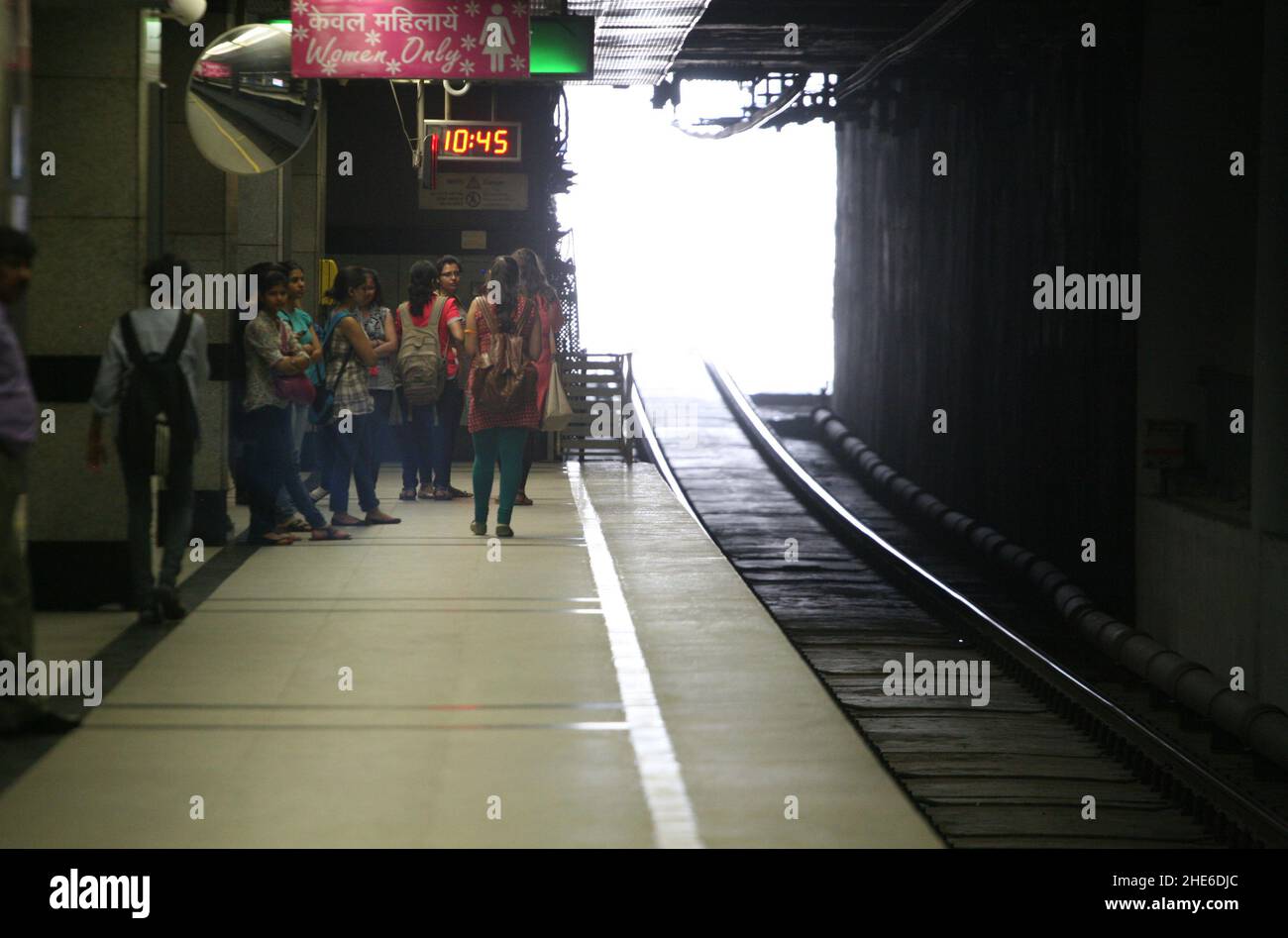 Female passengers wait for a delhi metro train at Mandi house Metro ...