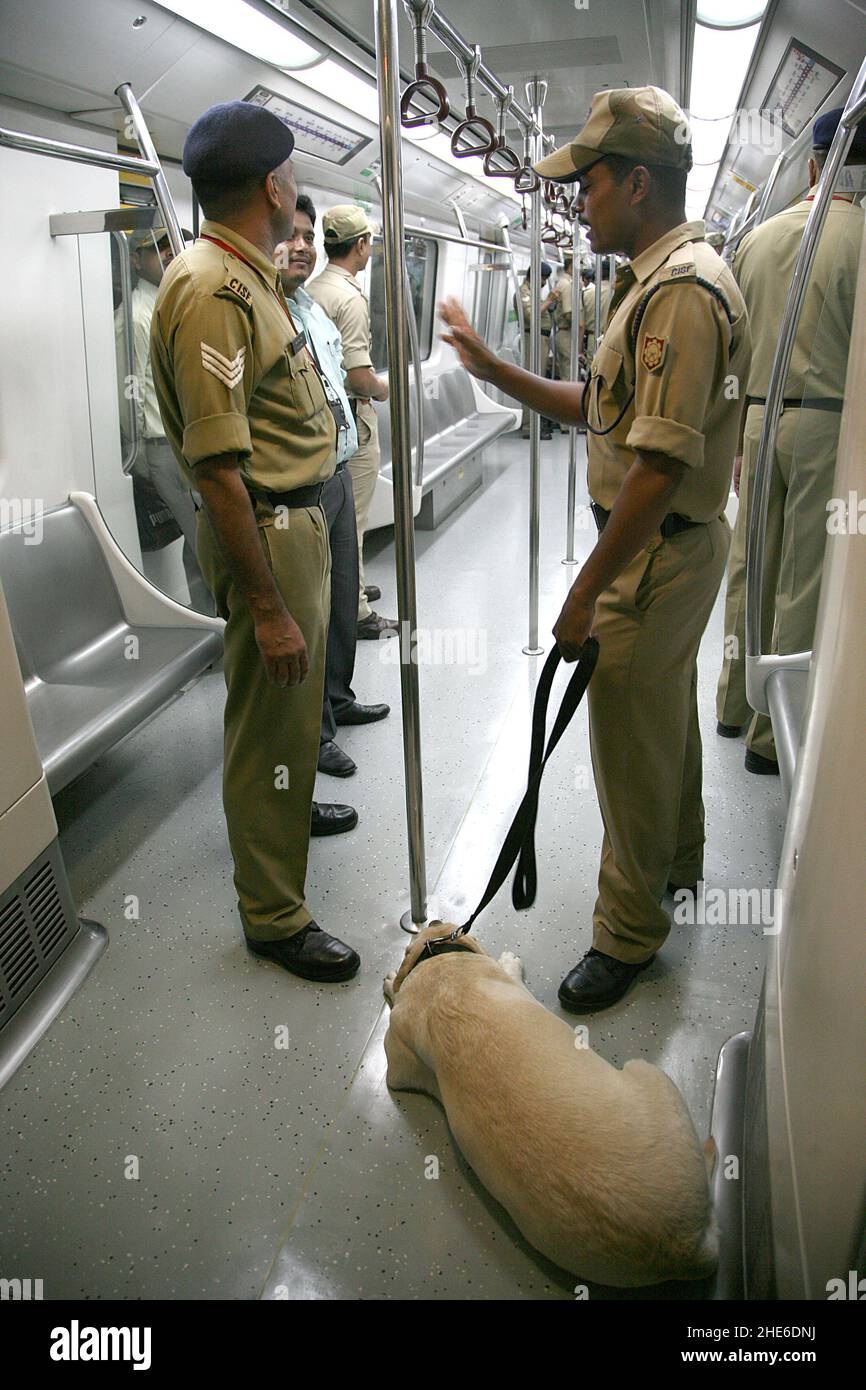 Security Staff in stand in a newly inagurated metro train in New Delhi ...