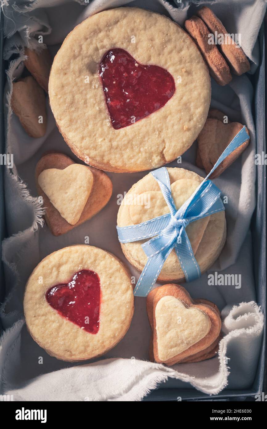 Homemade biscuits for valentine made of butter and strawberries jam ...