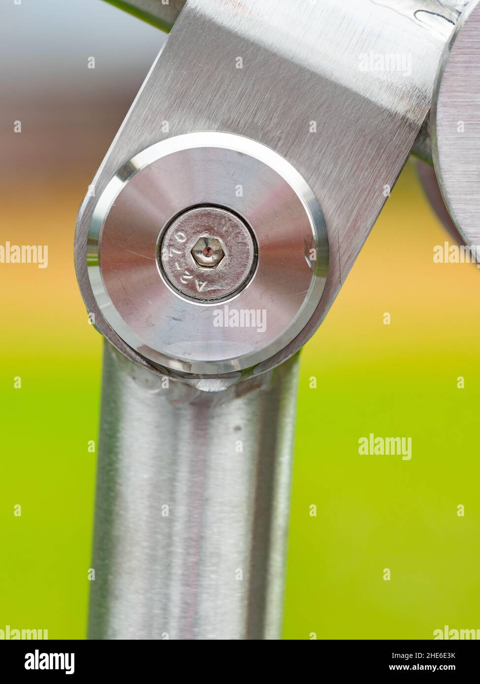 Hexagon screws hold horizontal axe in exercise machine. Construction of ...