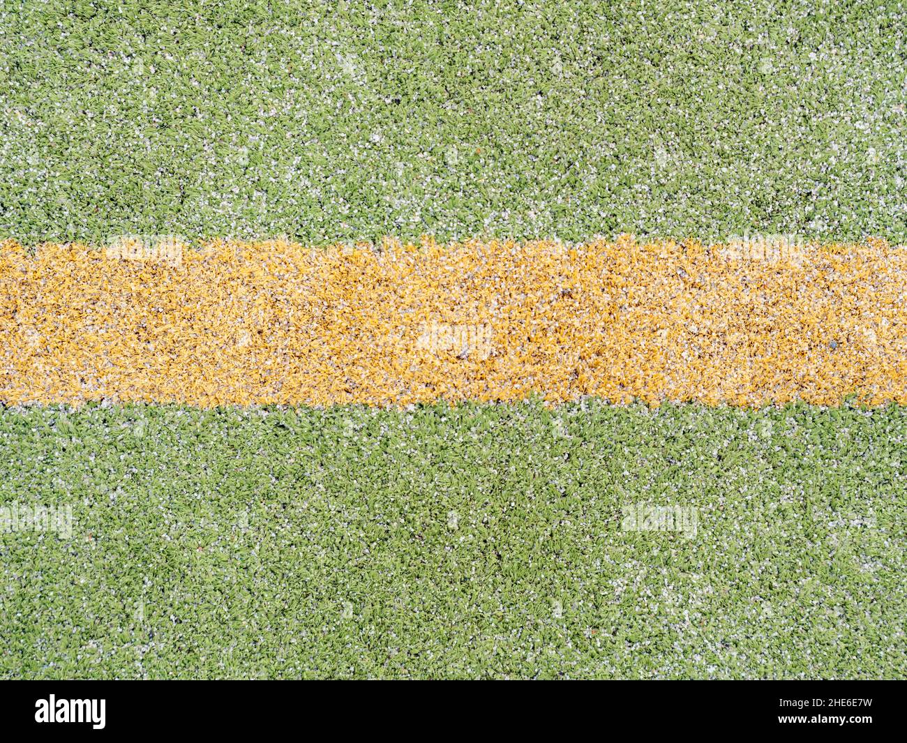 Yellow marks and lines on outdoor football or hanball playfield. Detail ...