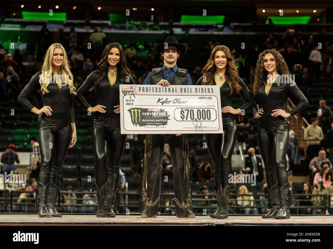 Kyler Oliver of Roy, Utah poses with winner's check at PBR Unleash The ...