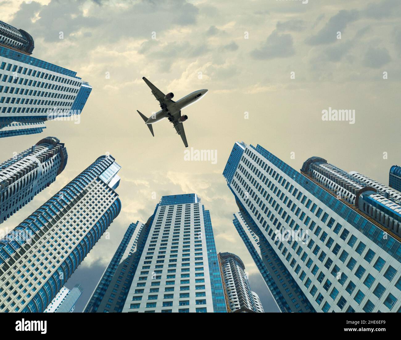 Plane encircled by buildings Stock Photo - Alamy