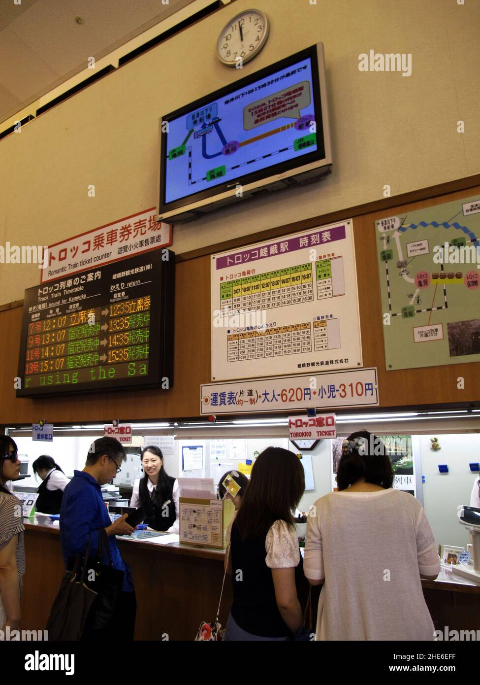 Japanese people and foreign travelers passenger wait and stand in queue ...