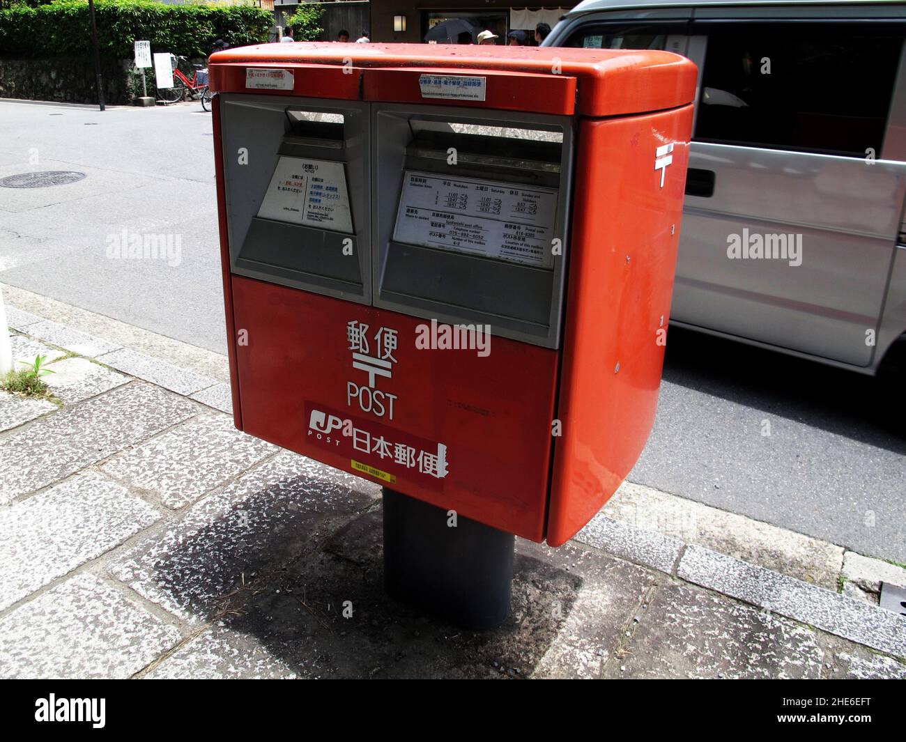 Classic antique vintage retro red public post box on street path for ...