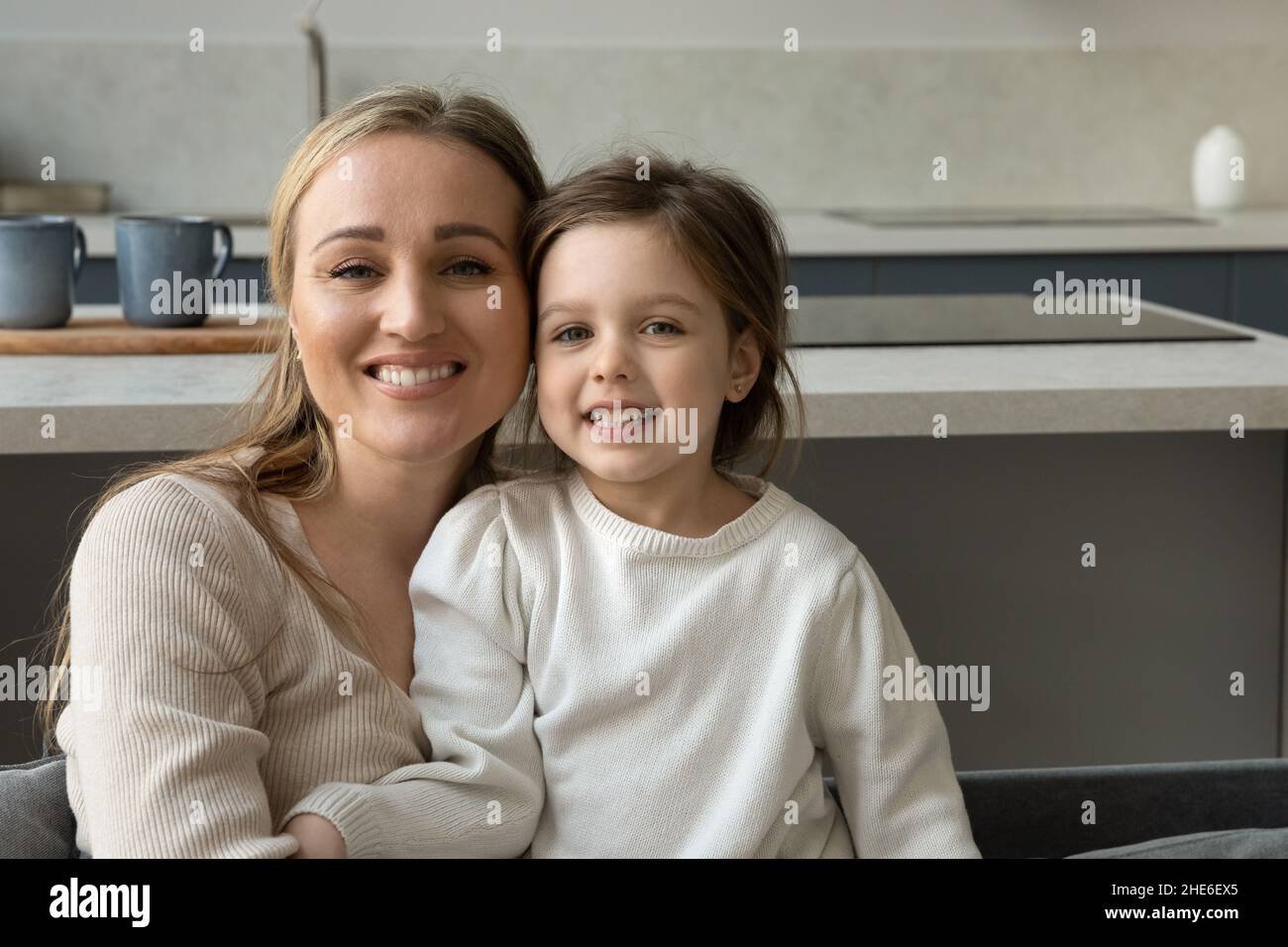 Happy mom and cute preschool daughter girl hugging with love Stock ...