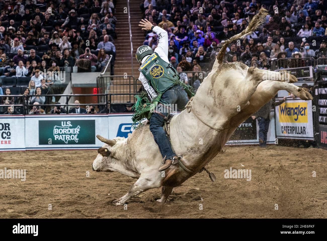 Daylon Swearingen of Piffard, New York rides a bull during 2nd day of ...