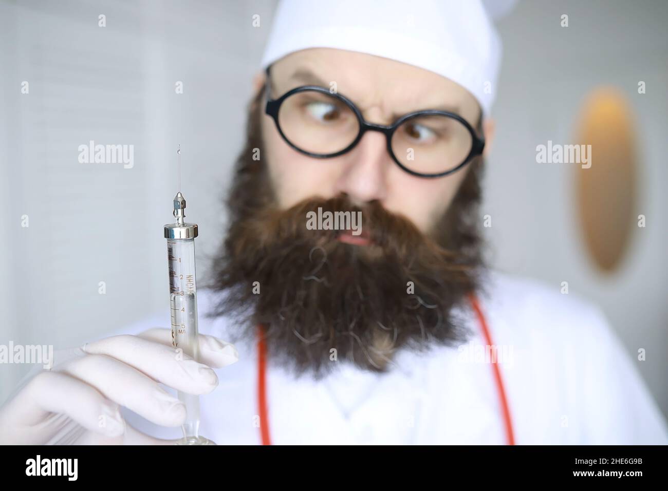 Doctor crazy. Mad beard scientist conducts experiments in a scientific ...