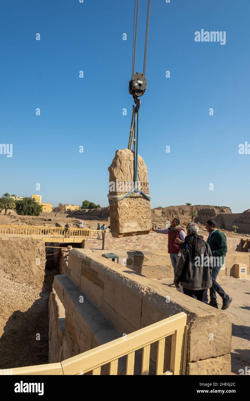Egyptian archaeologists excavate an ancient stone tablet with ...