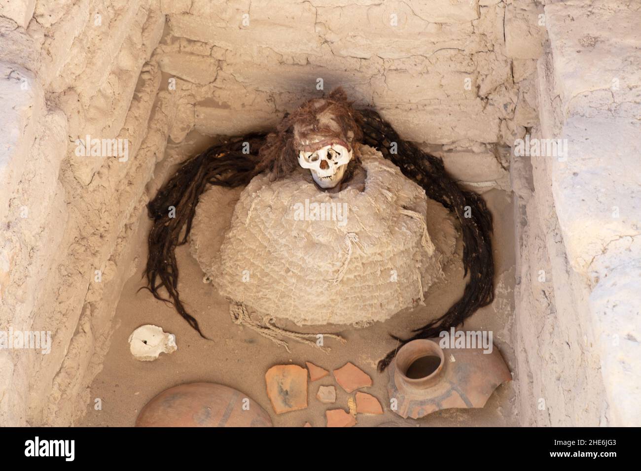 Bones in open inca cemetery in Nazca region , Peru Stock Photo - Alamy