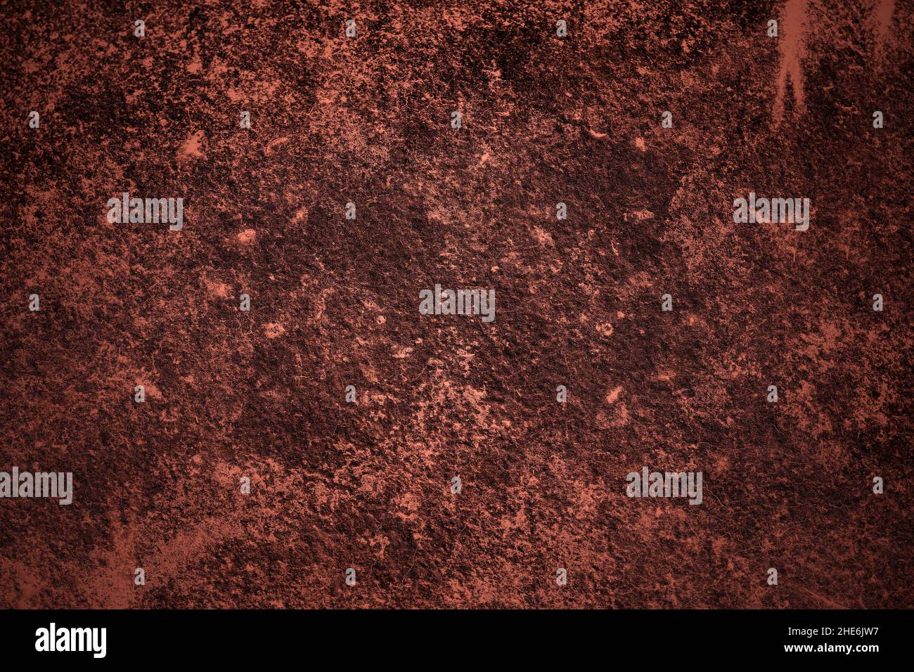 Rough grunge texture on a reddish stone wall surface for background ...
