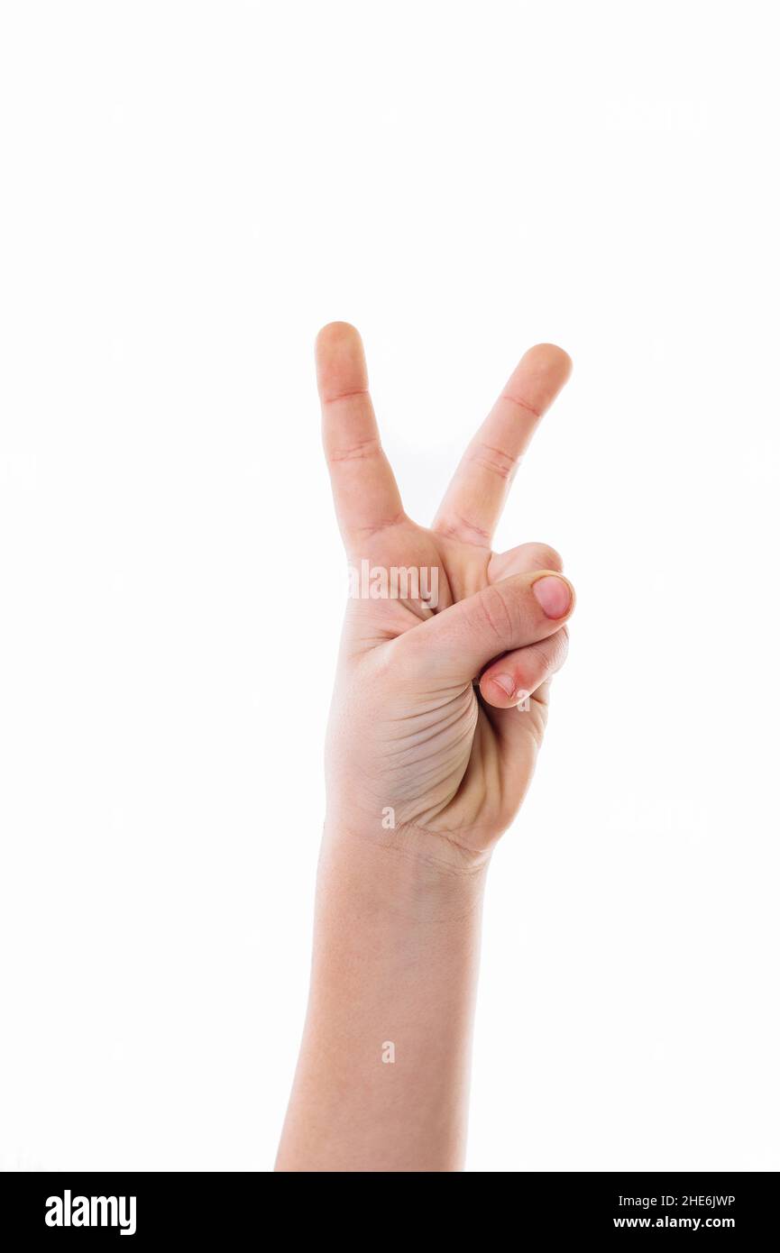 isolated child hand shows the number two. Hand of caucasian young man ...