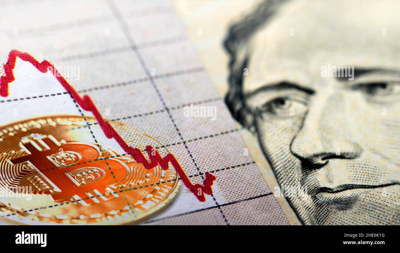 Cryptocurrency coin on top of a US dollar bill Stock Photo - Alamy