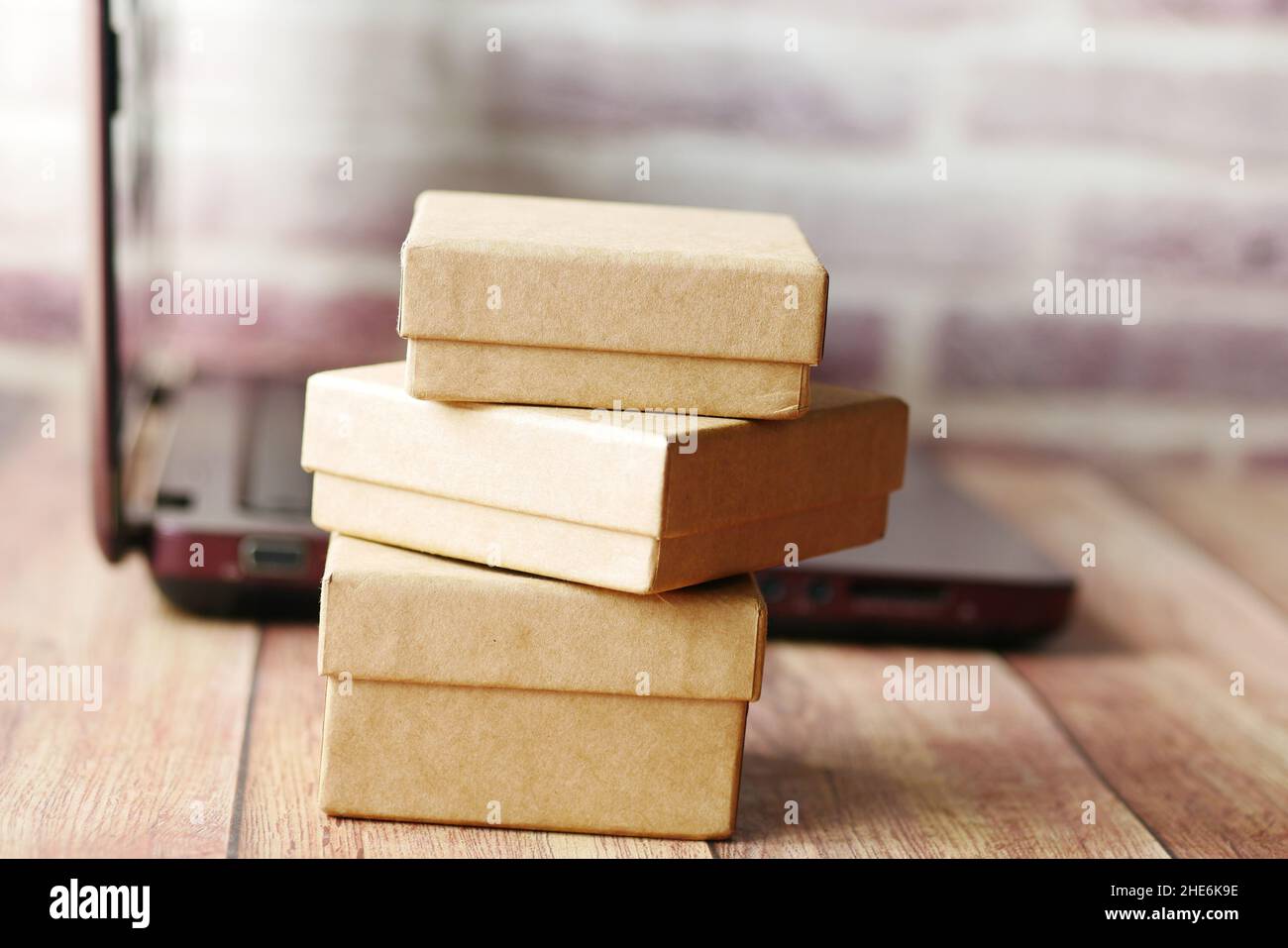 Stack cardboard parcels laptop on hi-res stock photography and images ...