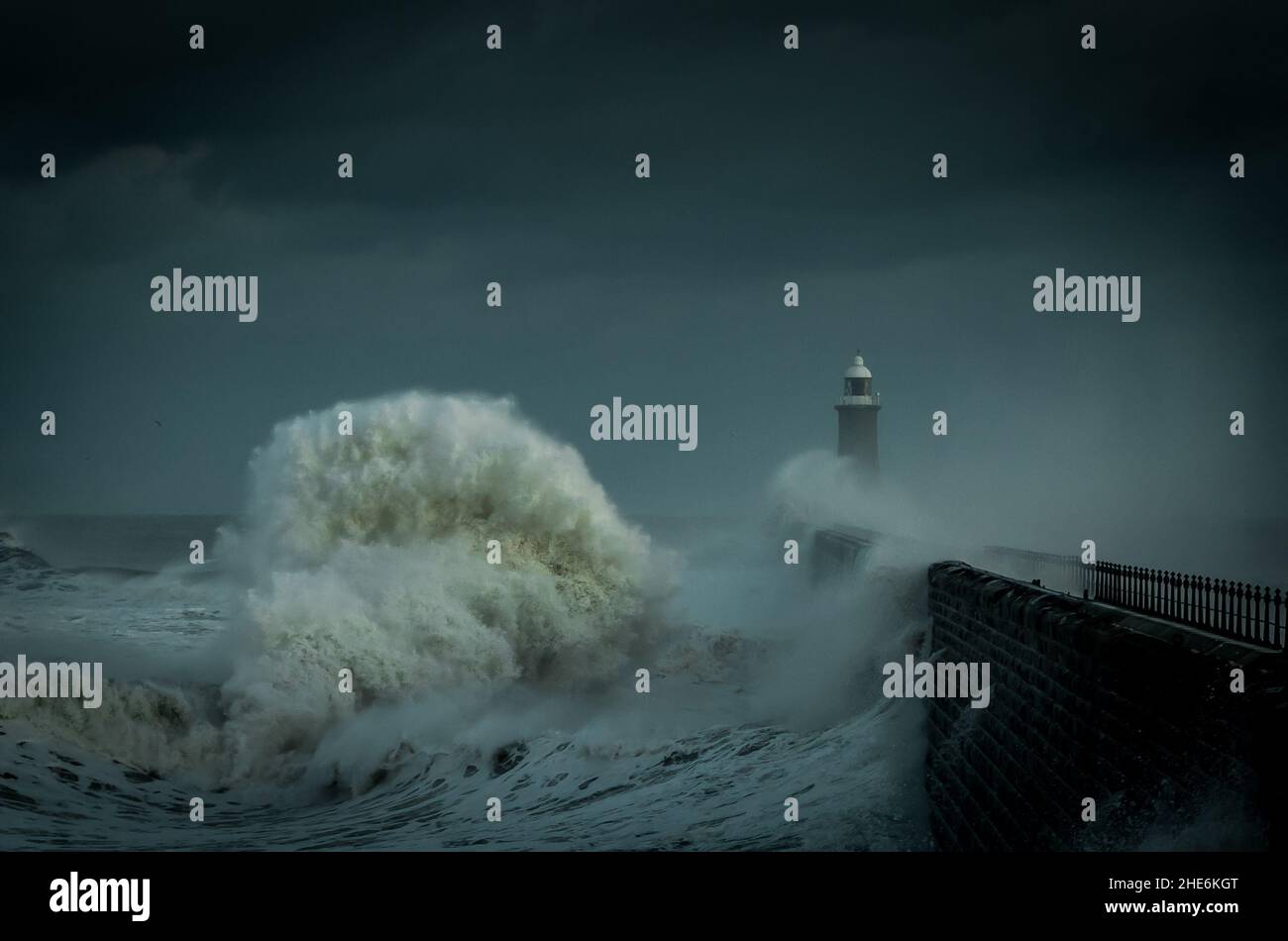 Giant waves batter the lighthouse & north pier guarding the mouth of ...