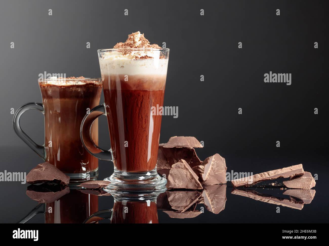 Hot chocolate with whipped cream and pieces of broken dark chocolate ...