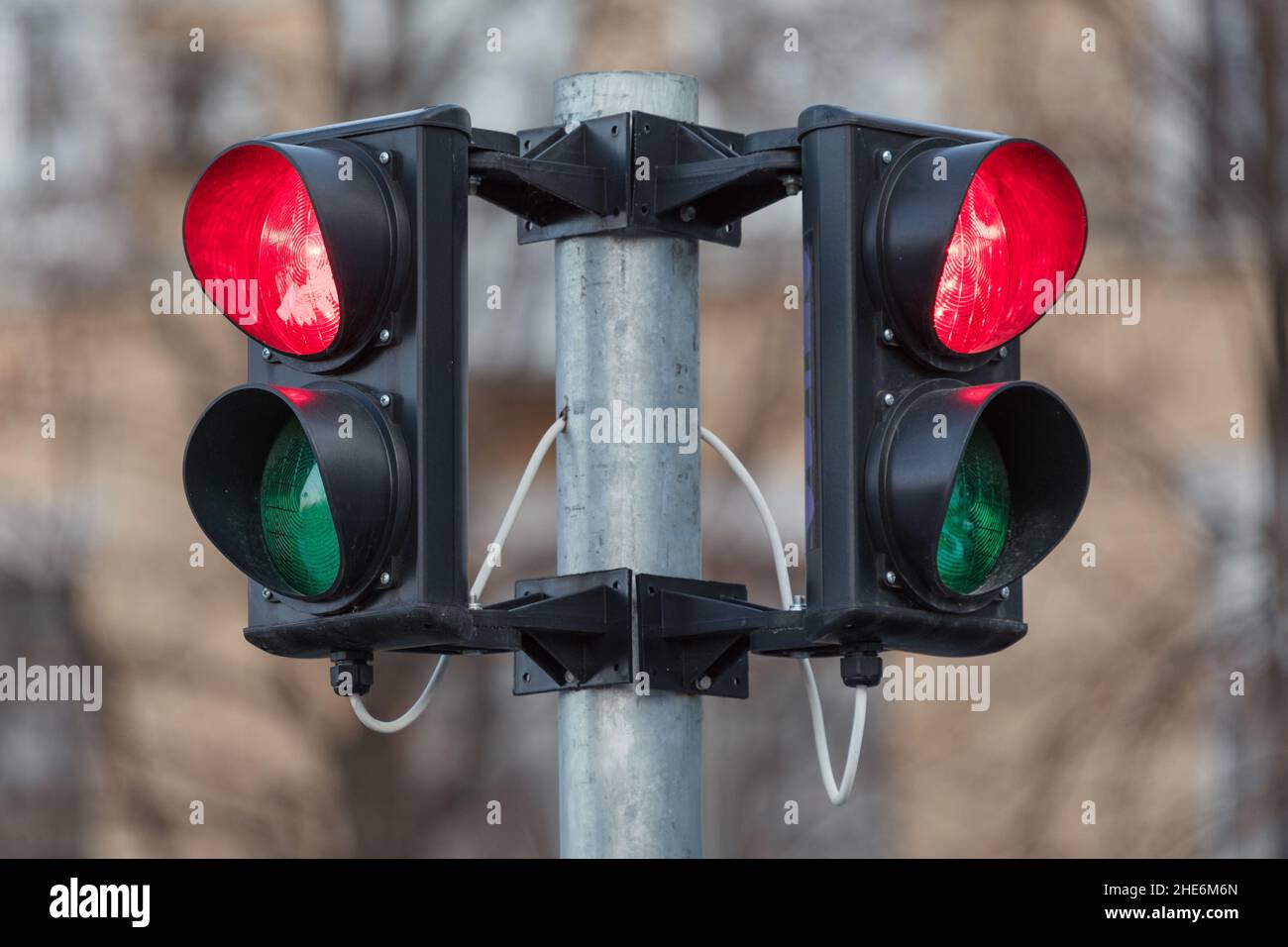 Red traffic light, city background. Semaphore showing a red light in ...