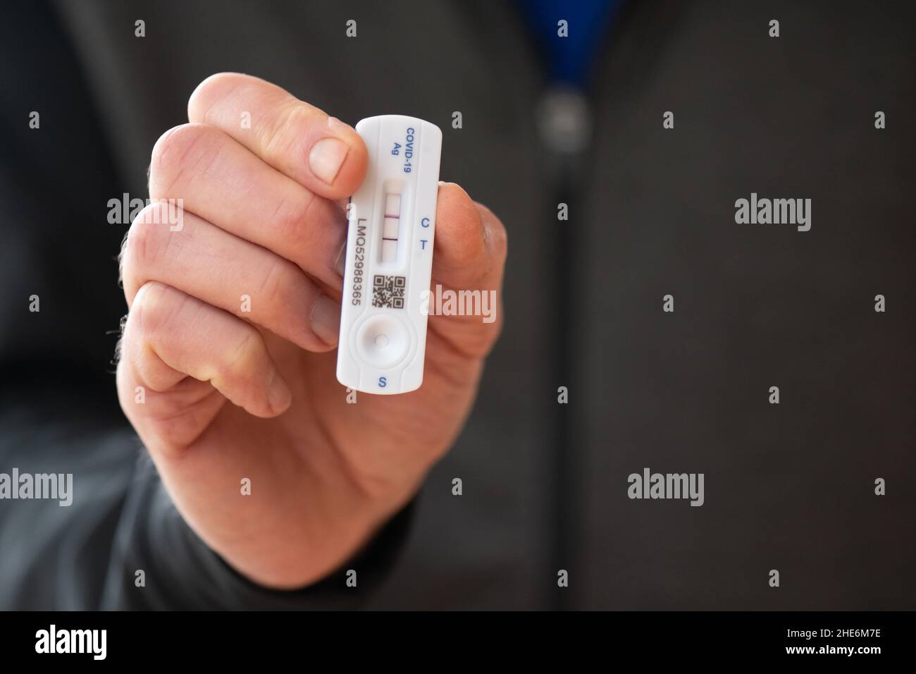 Person holding positive lateral flow test hi-res stock photography and ...