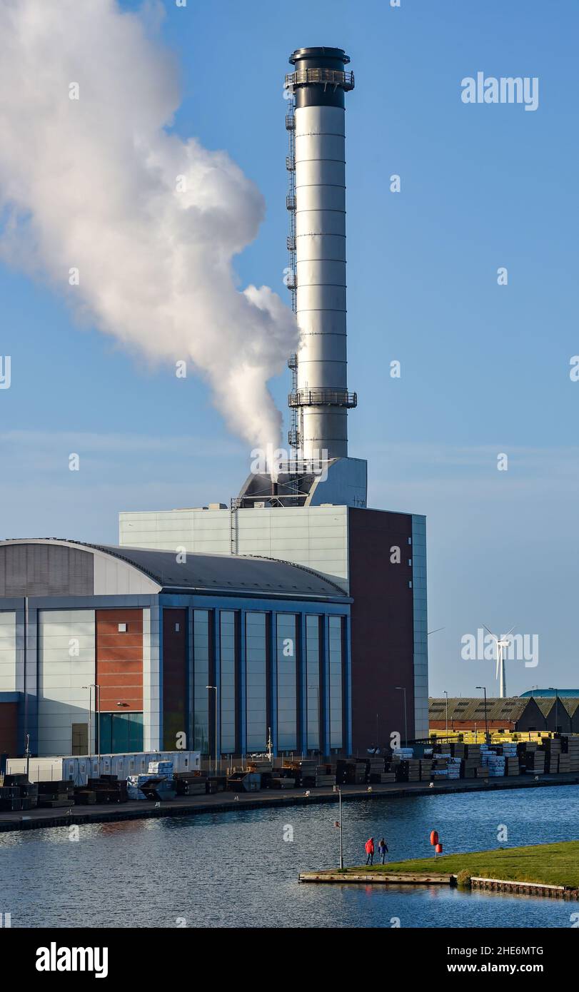 Brighton UK 9th January 2022 - Walkers pass by Shoreham gas-fired power ...
