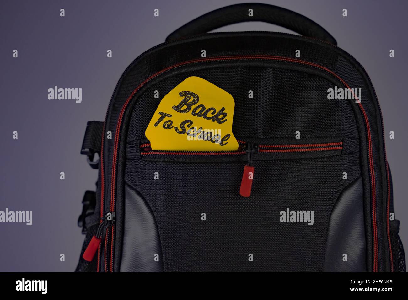 Back to school - the inscription on the sticker with school backpacks ...