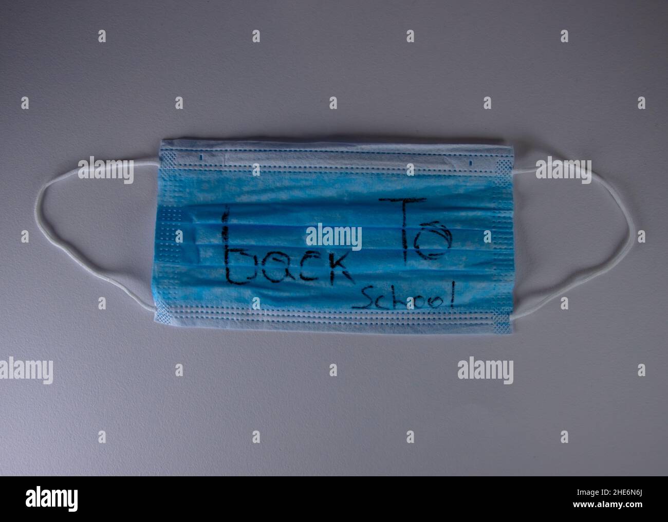 Back to school on covid-19 mask Stock Photo - Alamy