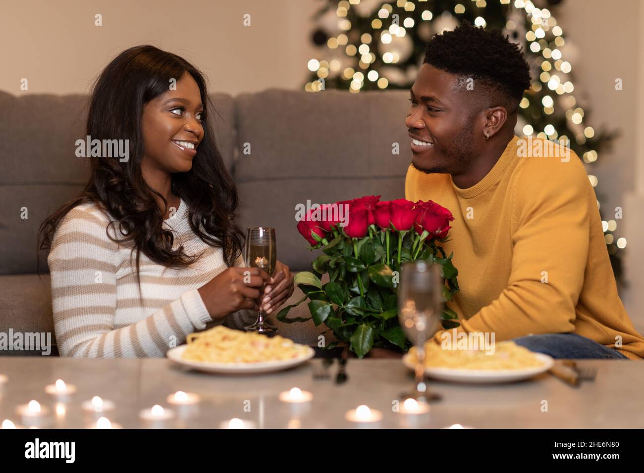 African American Guy Giving Roses To Girlfriend On Valentine's Indoor ...