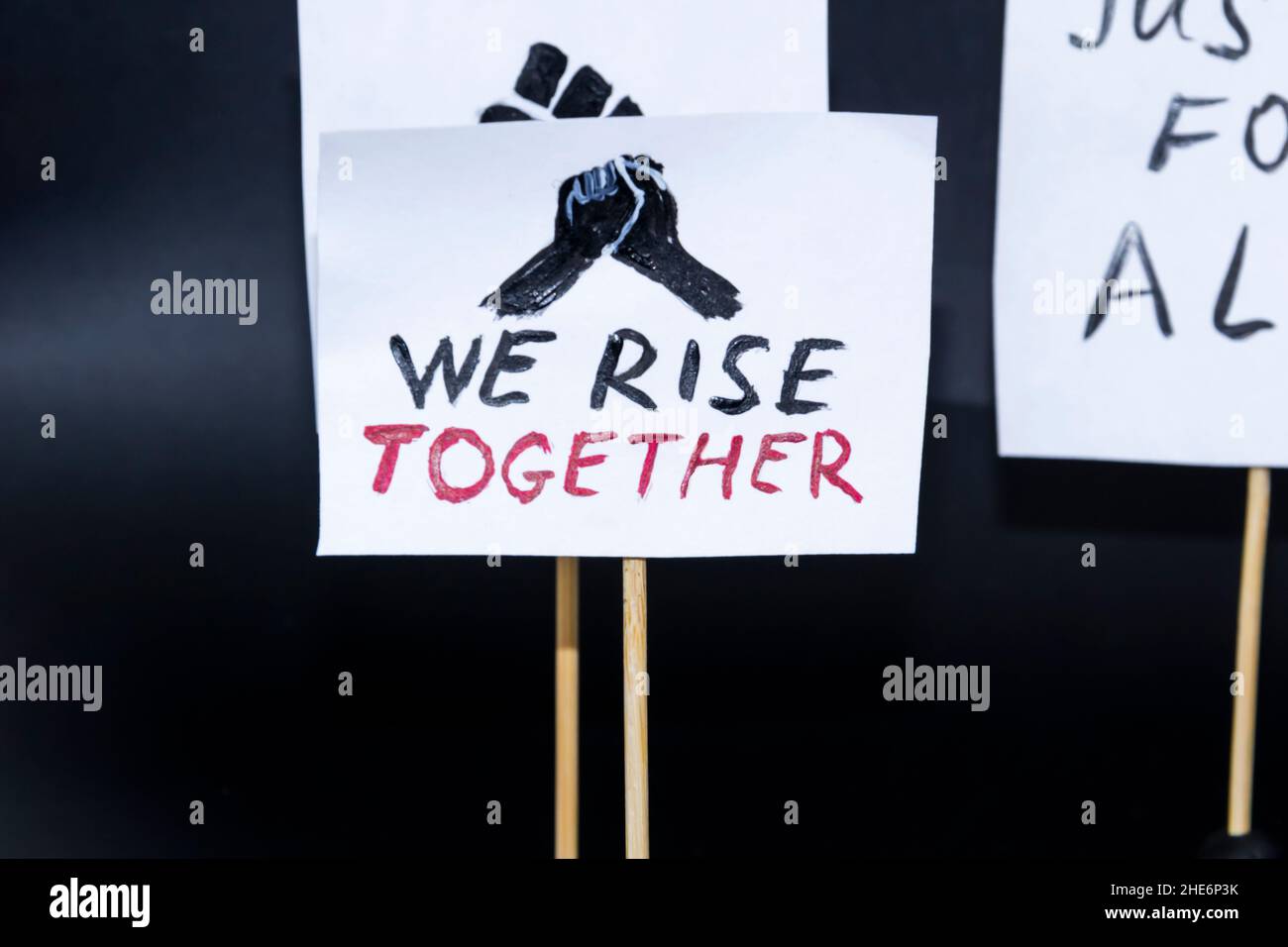 Concept of protest, rally, demonstration. Posters with words "WE rise ...