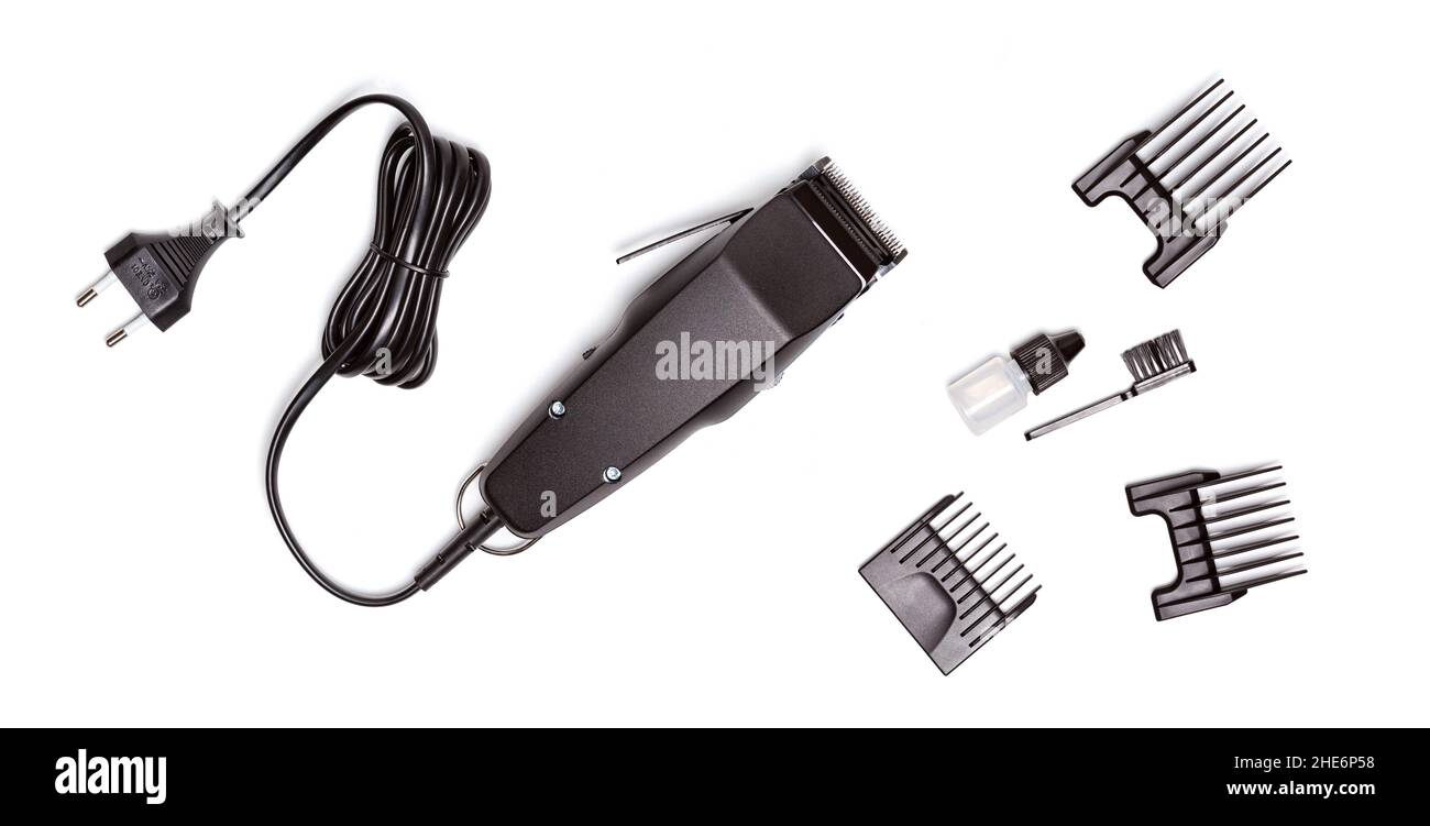 Professional hair clipper with set of nozzles of different sizes ...