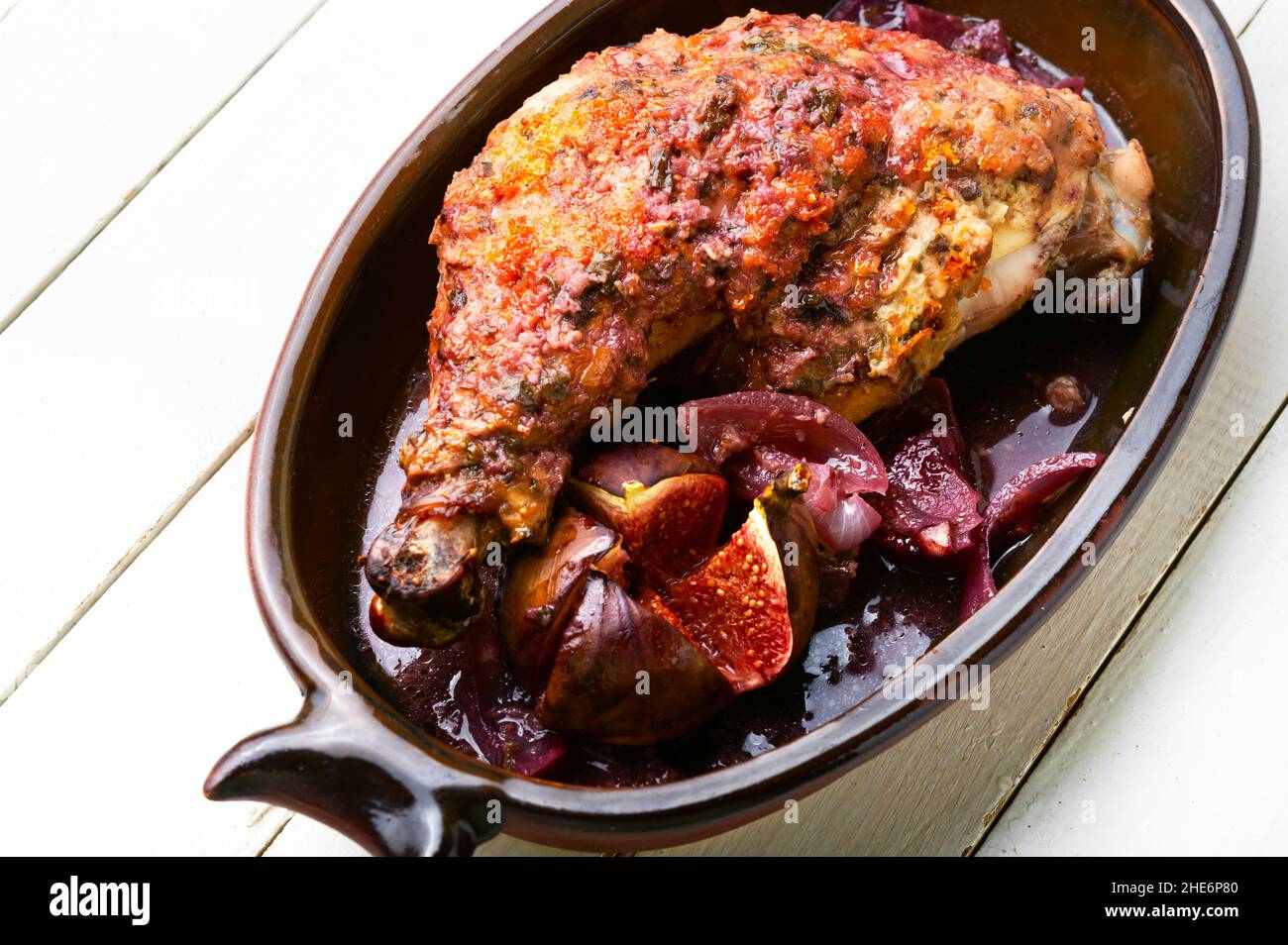 Chicken thigh fried in fig fruit. Meat poultry with figs sauce Stock ...