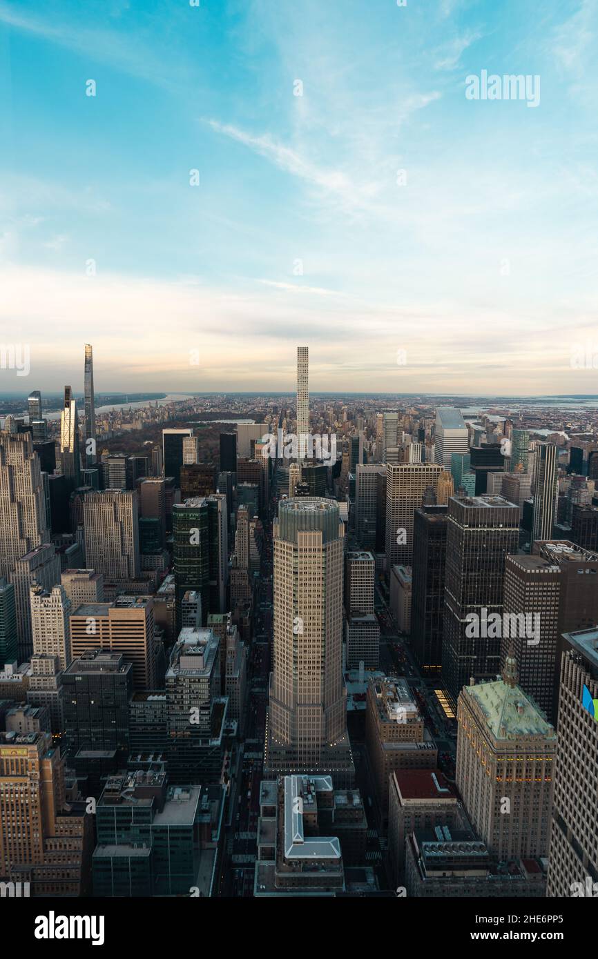 Vertical view from the top of skyscrapers in Manhattan in the daytime ...