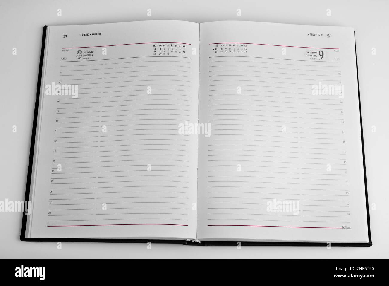 Open notebook with lines on a white Stock Photo - Alamy