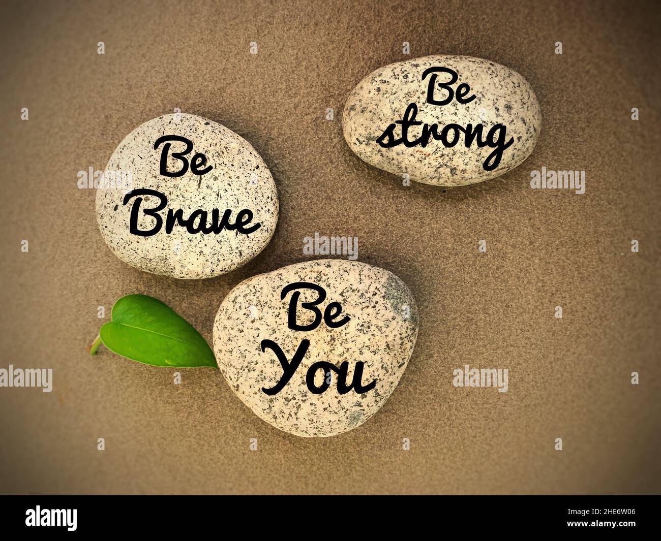 Be strong, brave and you on rocks with brown marble background ...